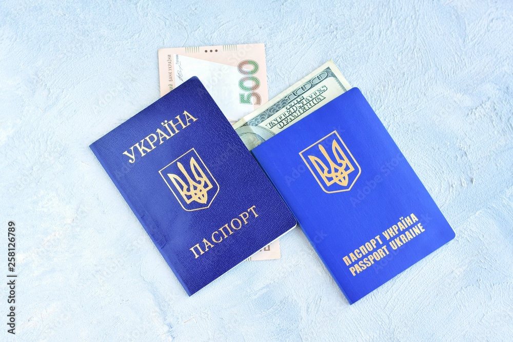 Internal passport of Ukraine with the national currency hryvnia inside ...