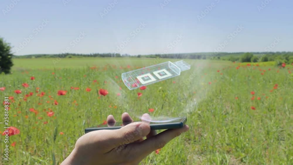 Hologram of USB drive on a smartphone. Person activates holographic ...