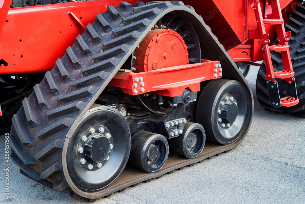 A close up of modern rubber tractor tracks Stock Photo | Adobe Stock