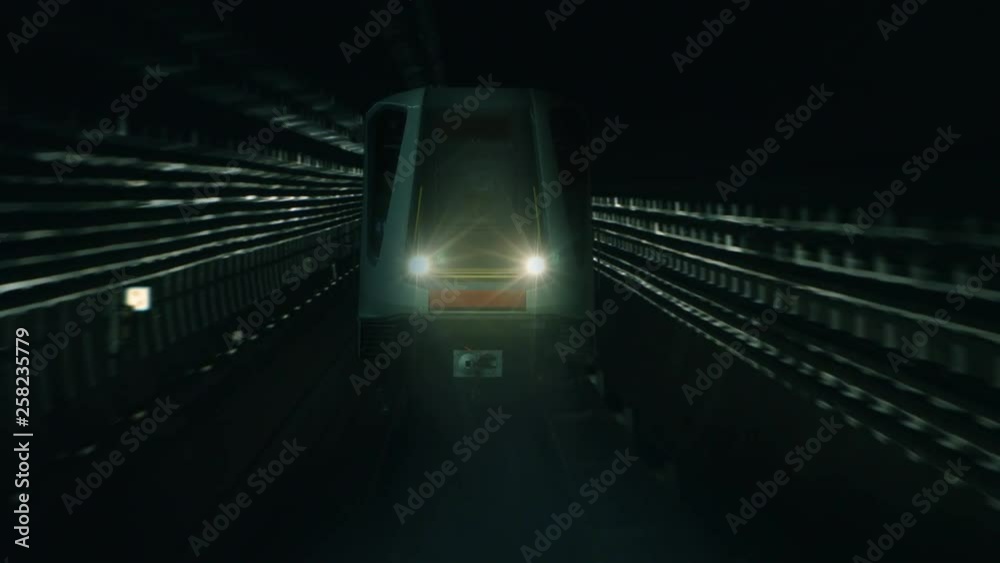 Underground subway train coming towards backward flying camera in a ...