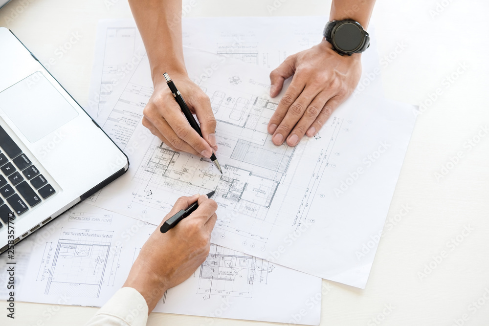 Close-up Of Person's engineer Hand Drawing Plan On Blue Print with ...