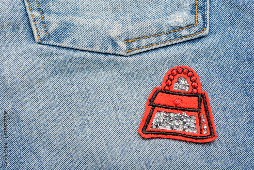 Red bag patch with rhinestones. Stock Photo | Adobe Stock