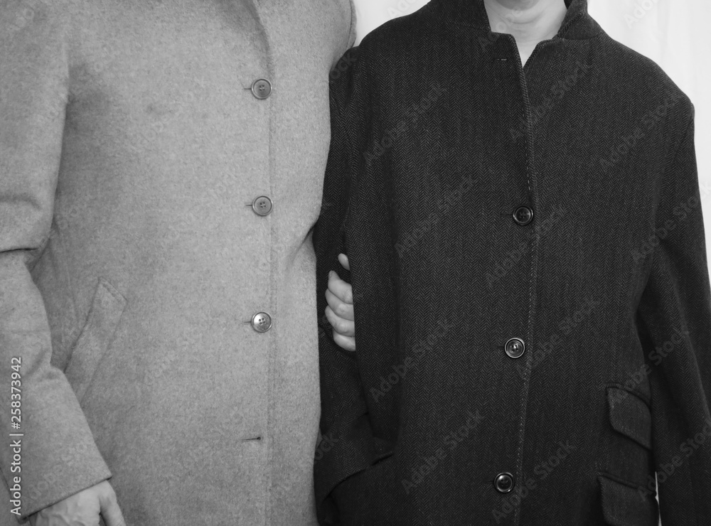 poor family with father and son with old worn coats Stock Photo | Adobe ...