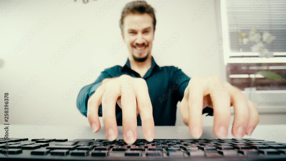 Vidéo Stock Hitting the keyboard and making funny faces 4K. Low angle ...