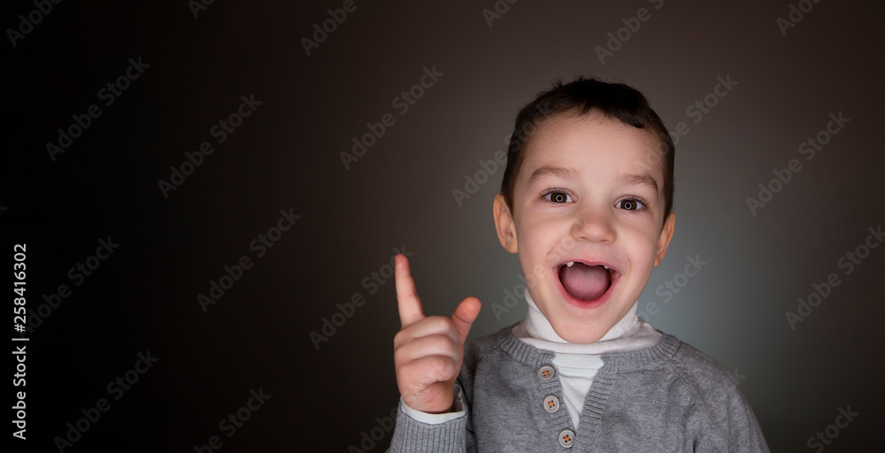 Funny little boy with no teeth pointing up with big smile. idea Concept ...