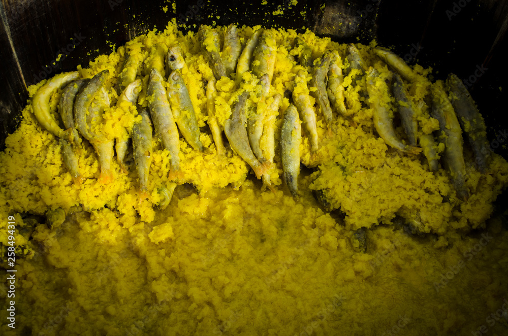 Scapece, piccoli pesci marinati tipici del Salento Stock Photo | Adobe ...