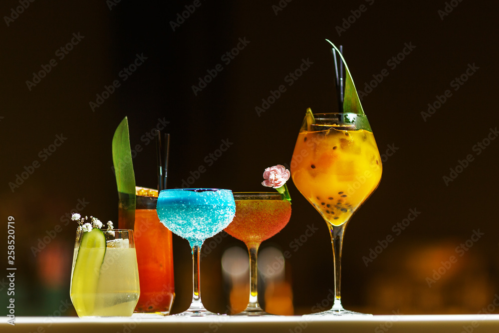 A set of different alcoholic cocktails in glass glasses on the bar ...
