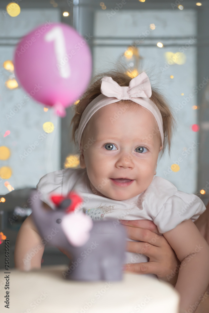 Little baby girl celebrating birthday. Happy child celebrates birthday ...
