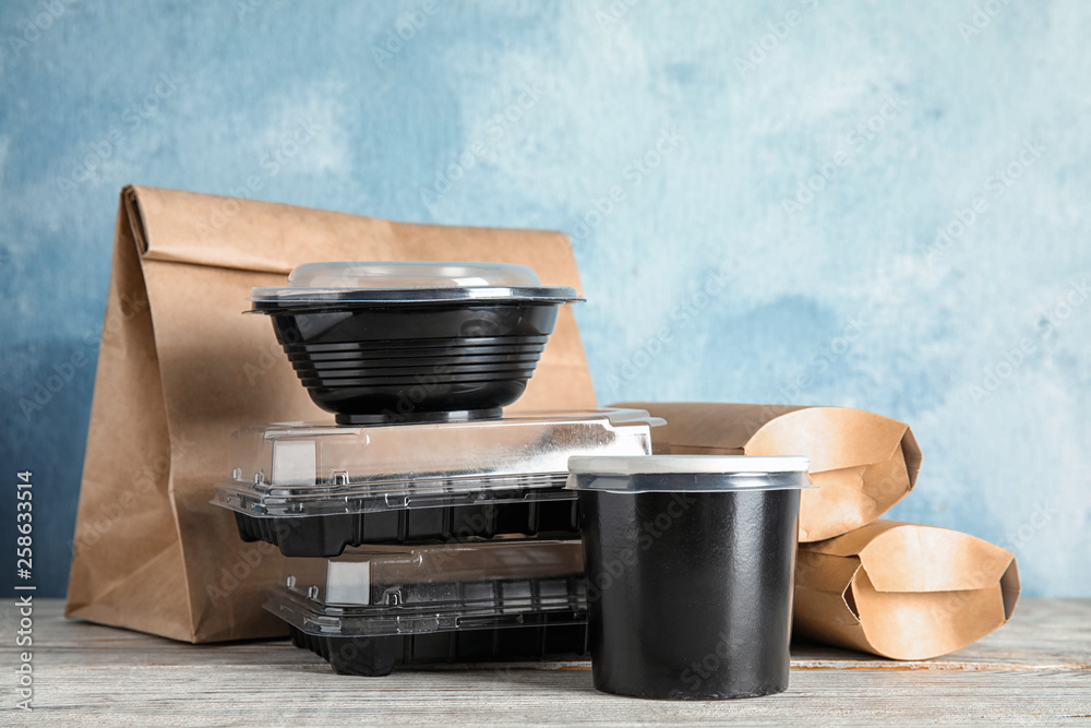 Various takeout containers on table. Food delivery service Stock Photo ...