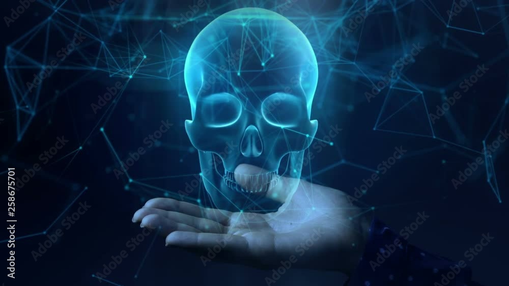 Blue hologram humans skull structure rotating in a woman hands ...