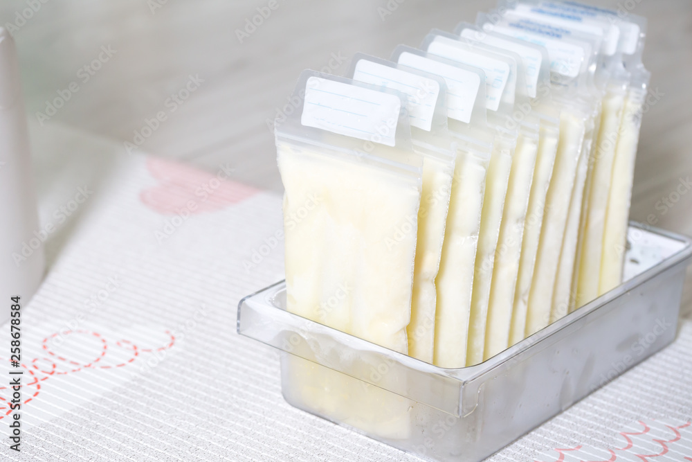 Frozen breast milk in plastic bag Stock Photo | Adobe Stock