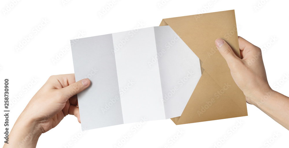 Hands pulling a blank folded paper out a brown envelope, isolated on ...