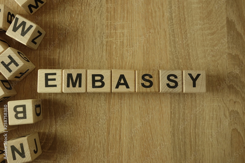 Embassy word from wooden blocks on desk Stock Photo | Adobe Stock