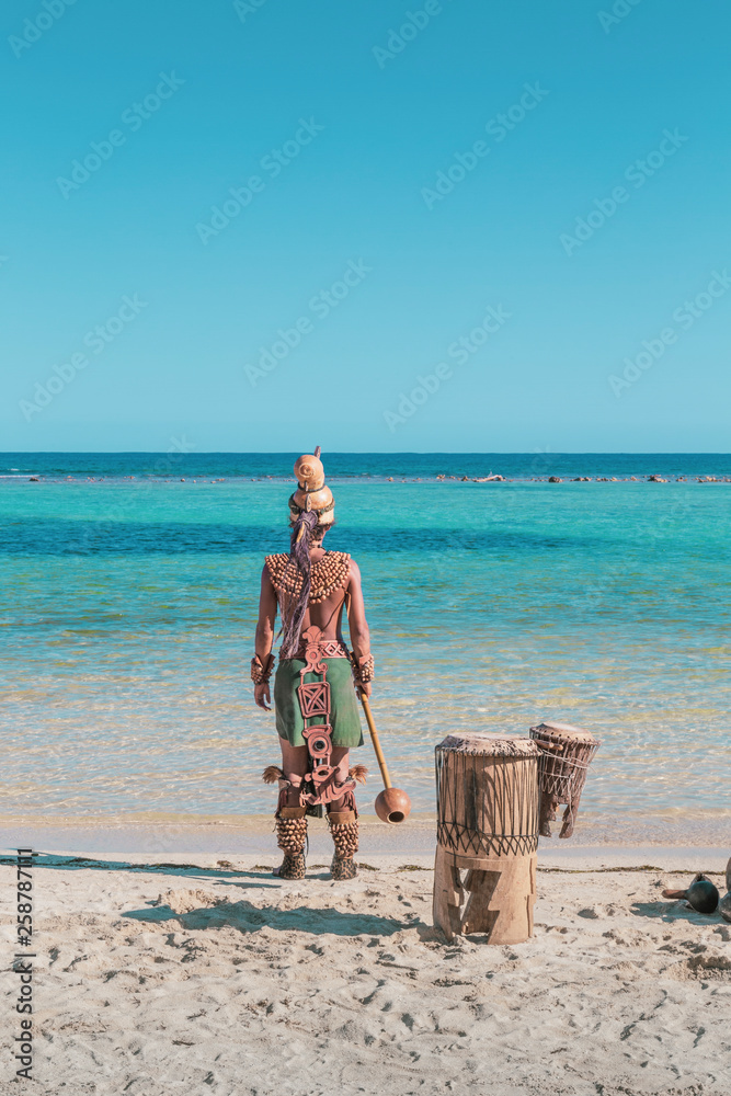 Mayan Warrior in traditional dress performs an ancient ritual dance on ...