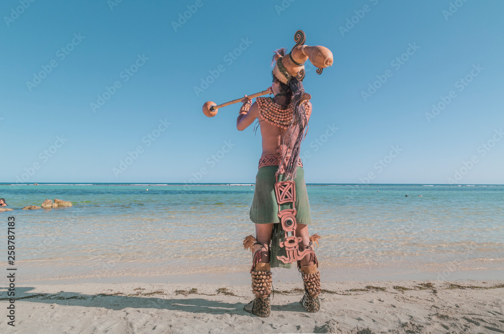 Mayan Warrior in traditional dress performs an ancient ritual dance on ...