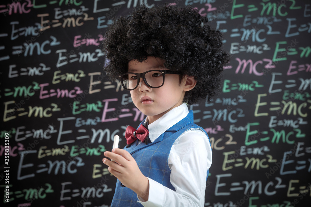 Primary school boy standing in front of the blackboard Stock Photo ...