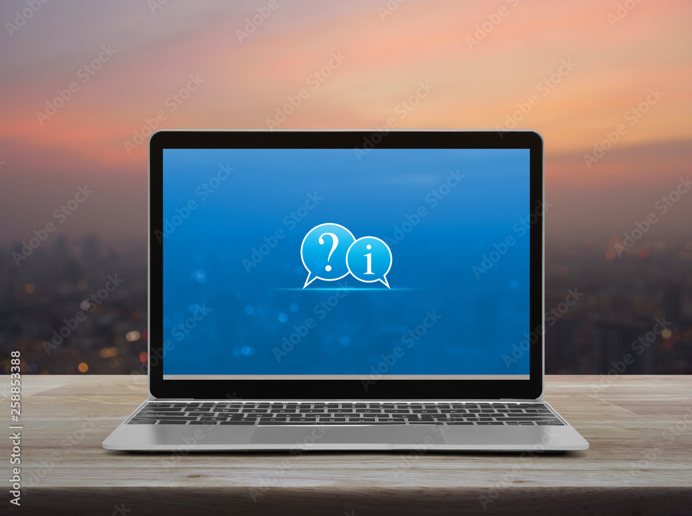 Question mark and information chat icon with modern laptop computer on ...
