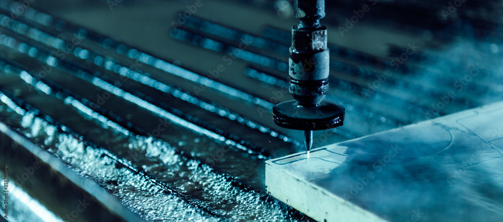 Water jet cutter machine cutting steel plate Stock Photo | Adobe Stock