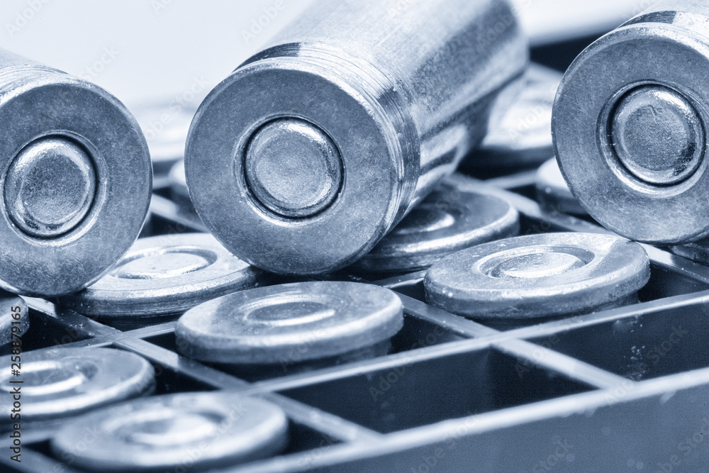 Pile of pistol bullets. The concept of limiting the spread of small ...