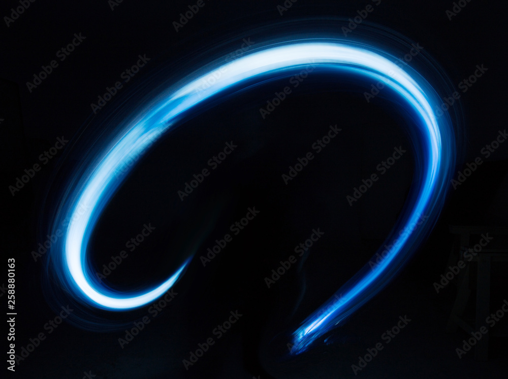 Glowing shiny curve light trail lines effect in black background. Stock ...