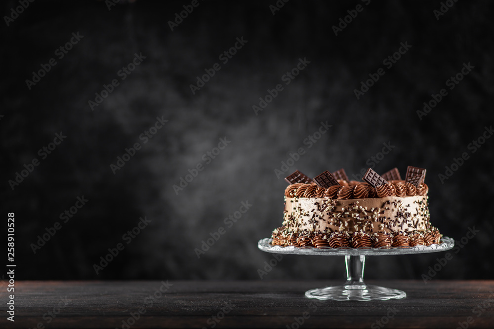 Decorated chocolate cake on dark background Stock Photo | Adobe Stock