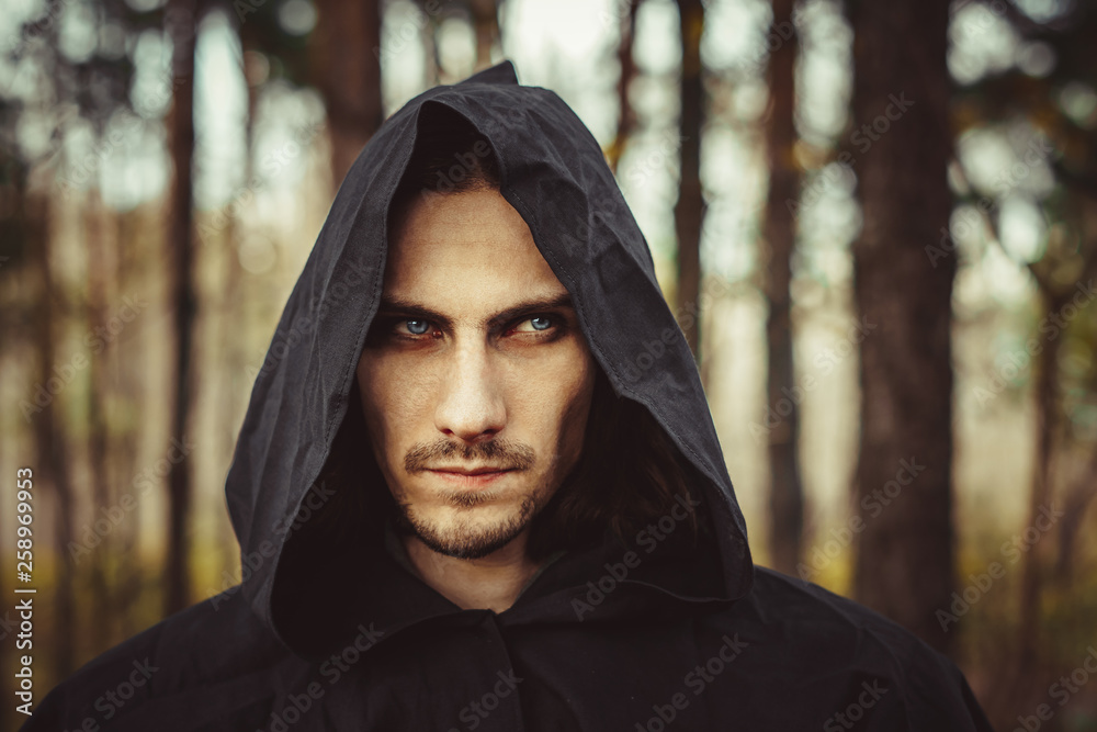 a monk in the hood Stock Photo | Adobe Stock