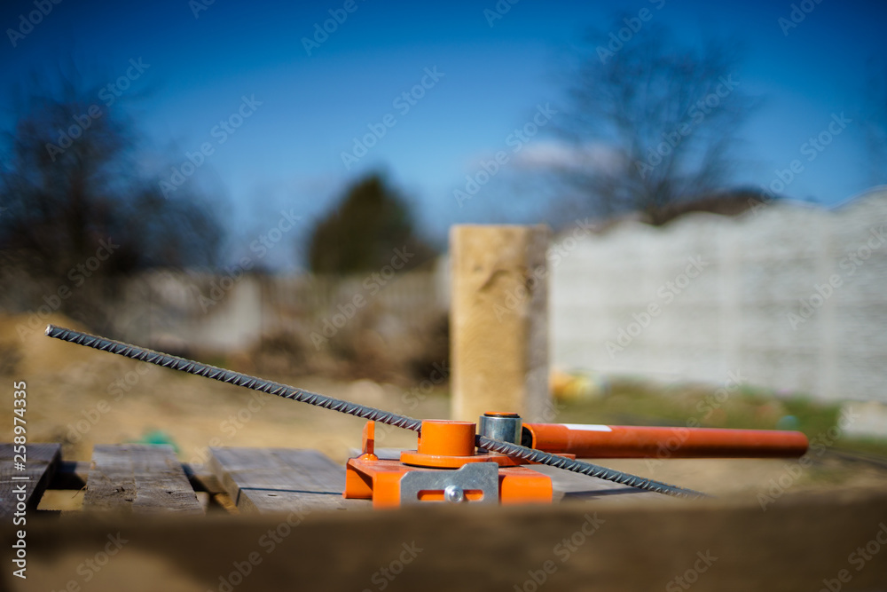 Bending rebar using a manual bending machine Stock Photo | Adobe Stock