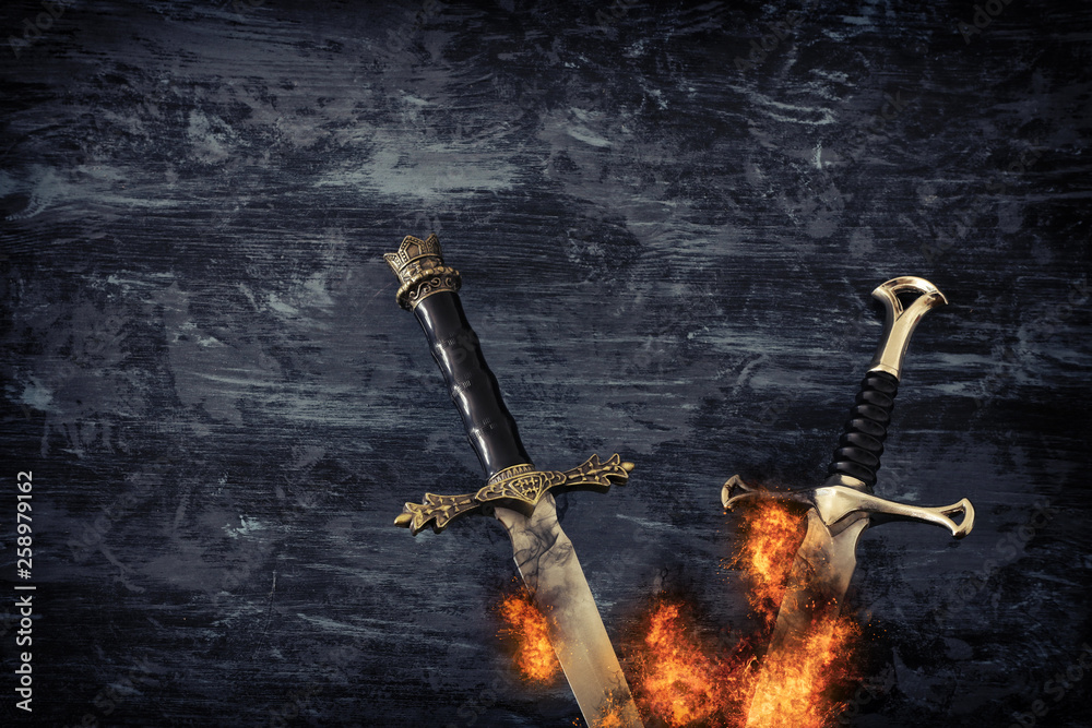 low key banner of silver sword in the flames of fire. fantasy medieval ...