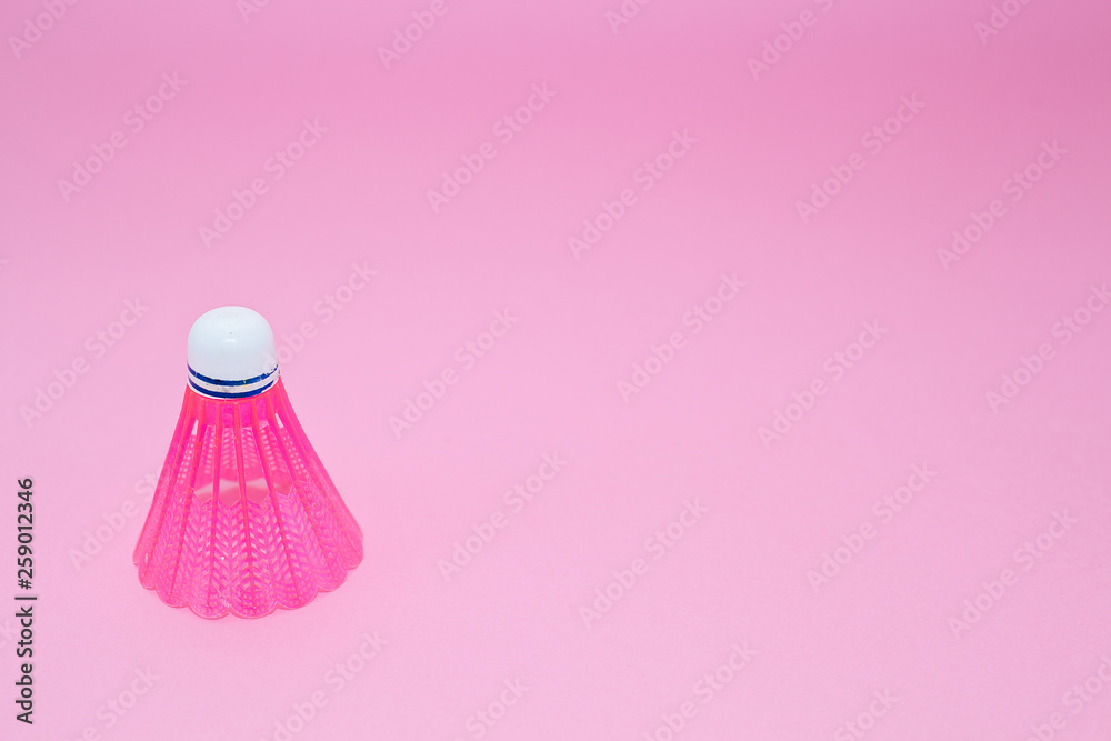 Pink badminton shuttlecock isolated on the pink background. Concept ...