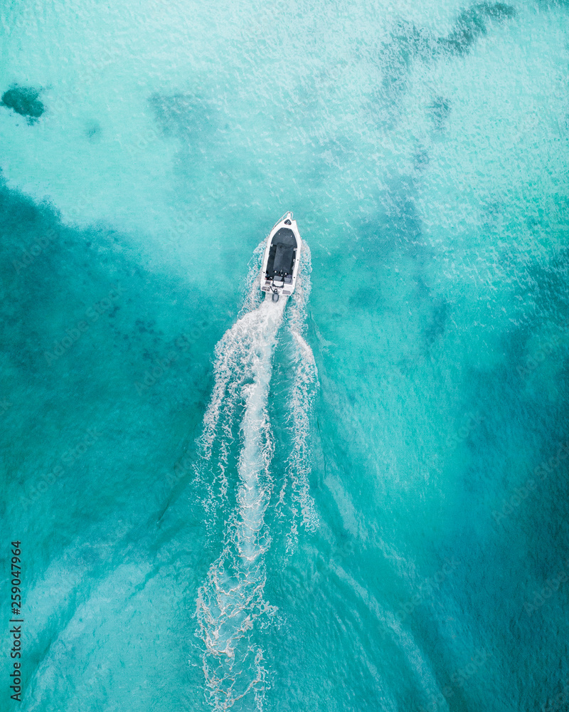 Beautiful boat cruising in the blue turquoise ocean of the holiday ...