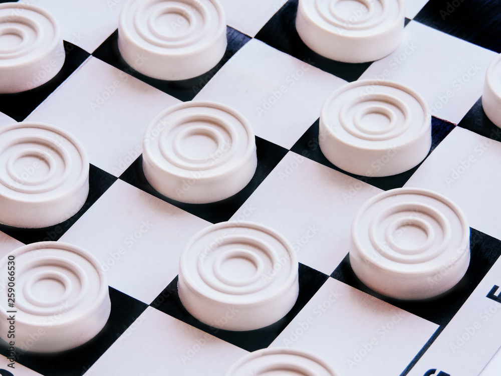 Checkerboard with checkers. Business strategy competition, strategic ...