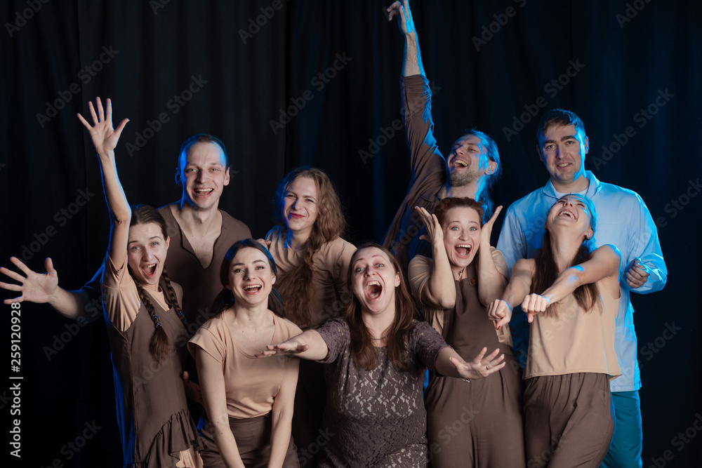 The actors on the stage play an emotion performance on a black ...