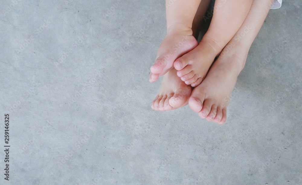 Soft image low section of mother's legs sitting and take a son to sit ...