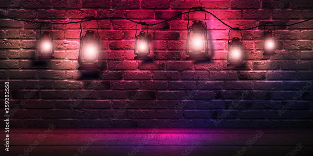 Dark old brick wall with night lanterns, wooden floor. Light spotlights ...