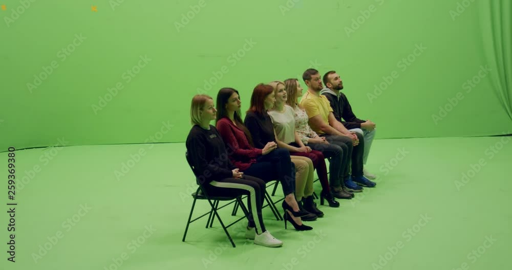 GREEN SCREEN CHROMA KEY Side view group of young people applause and ...