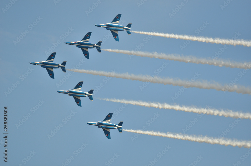 blue and white fighter jets flying in formation Stock Photo | Adobe Stock