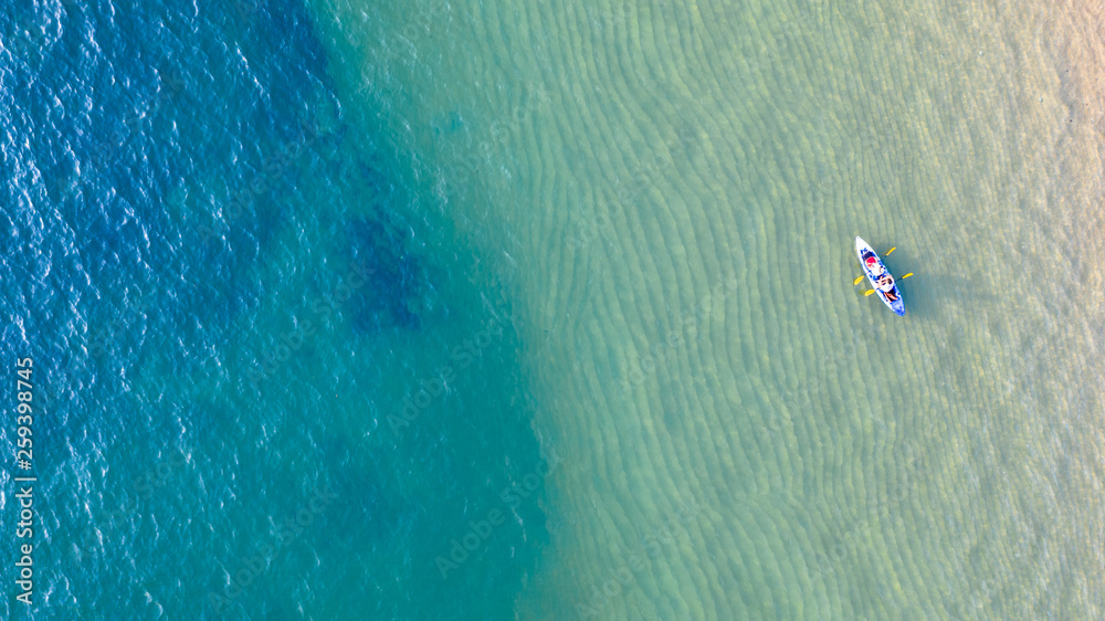 Aerial top view of kayaking around sea with shade emerald blue water ...