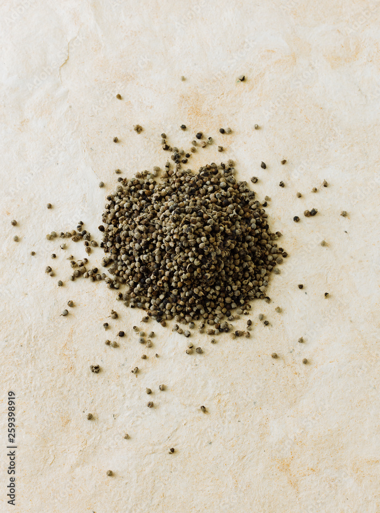 Pile of monk pepper ( vitex agnus castus ) isolated on paper background ...