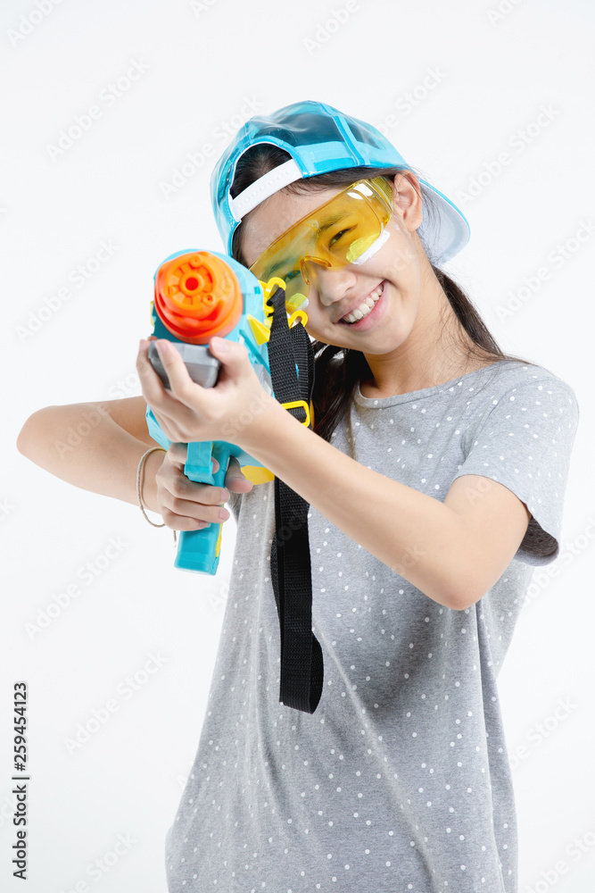 Happy beauty Asian girl holding plastic water gun at Songkran festival ...