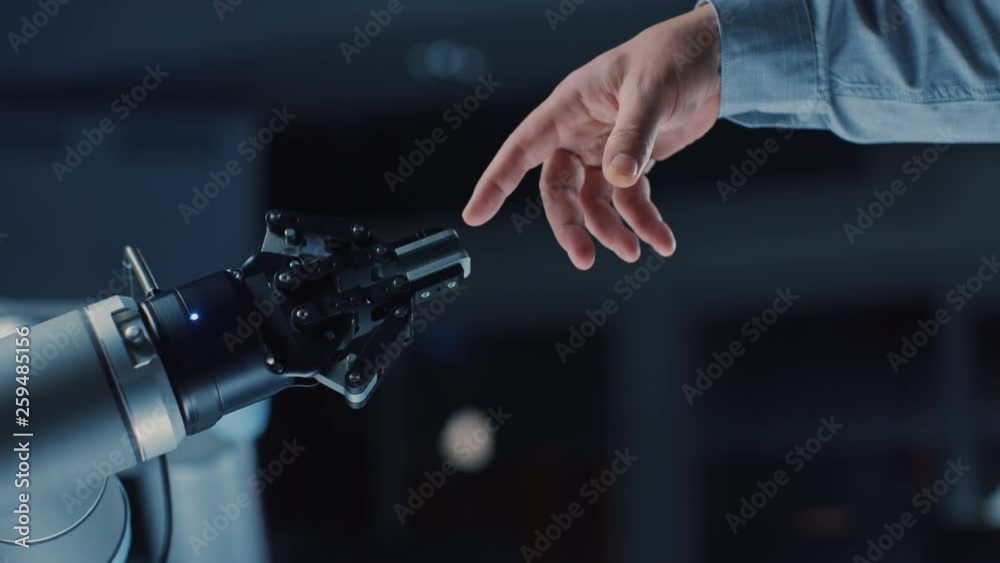 Futuristic Robot Arm Touches Human Hand in Humanity and Artificial ...