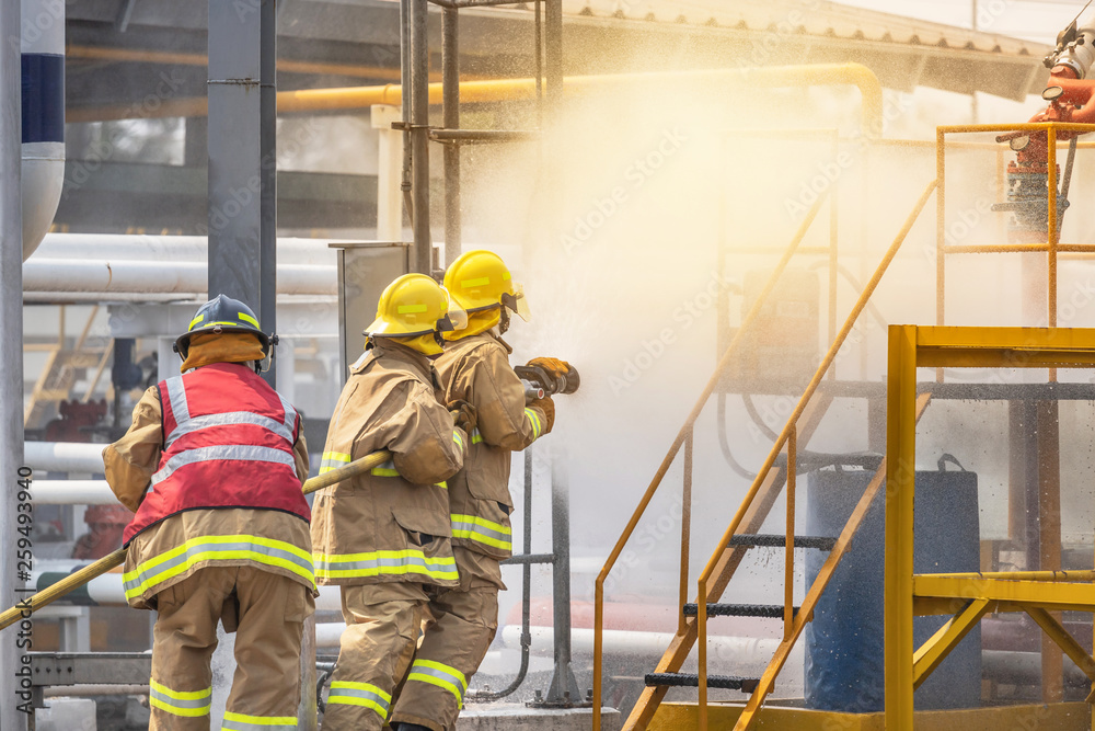 Fotografia do Stock: firemans brave buddy team assistance in yellow ...
