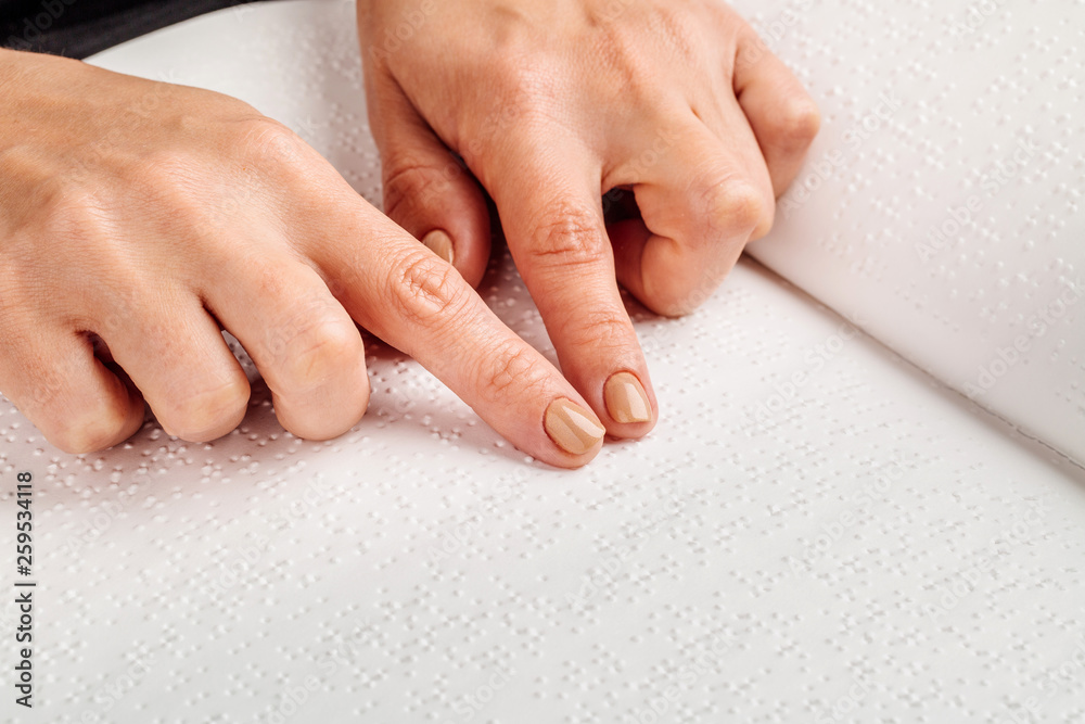 Finger read braille alphabet in white paper. Stock Photo | Adobe Stock
