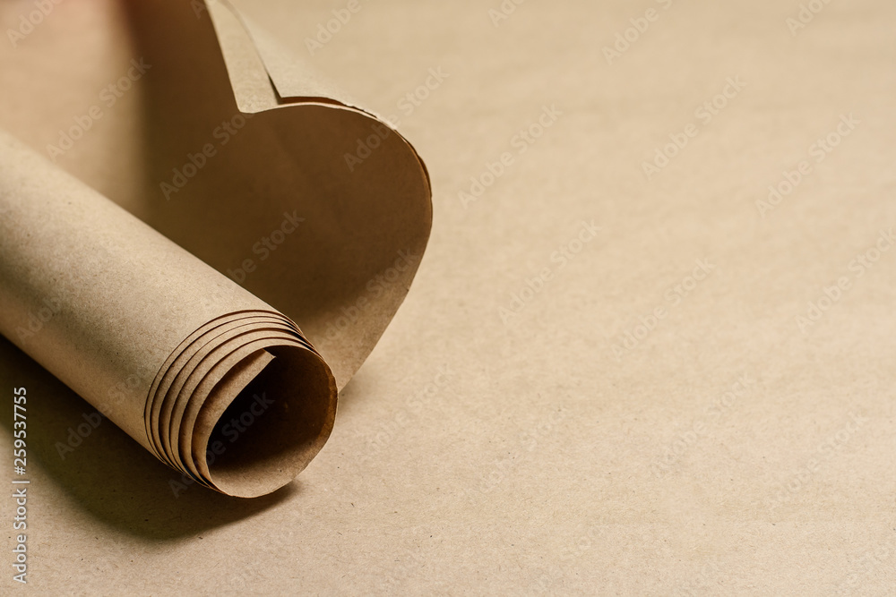 Kraft paper roll on kraft paper background. Eco paper. Recyclable ...