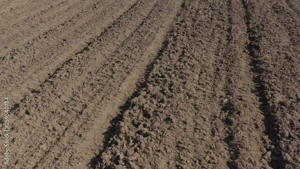 Fertile soil furrows made with plough 4K drone footage Stock Video ...