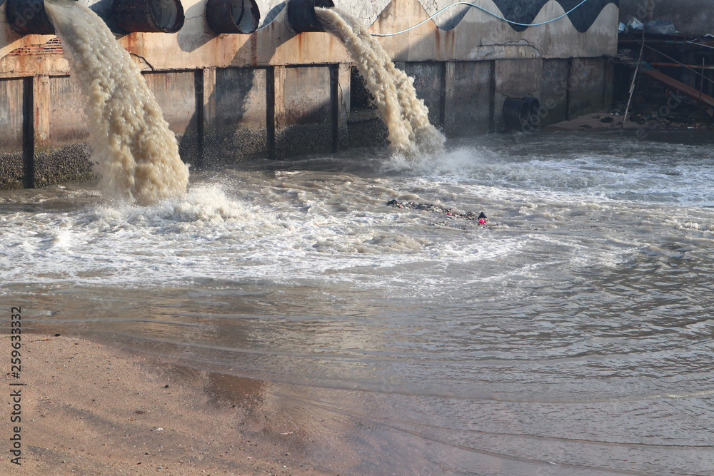 Waste water discharge pipe into canal and sea Stock Photo | Adobe Stock