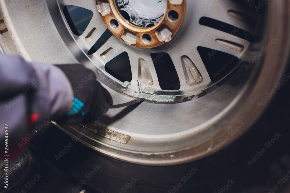 Wheel weights for balancing tires arrayed in trays for precise balance ...
