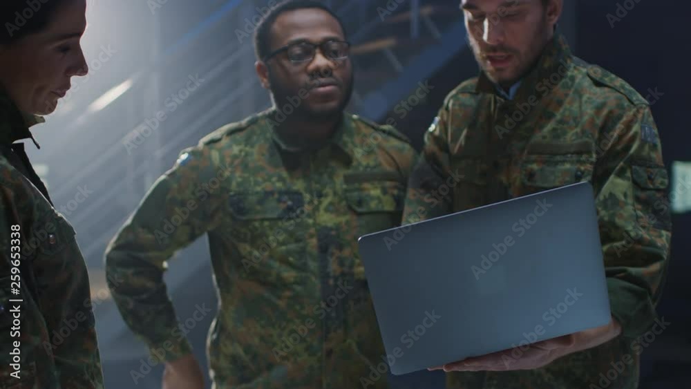 Diverse Team of Military Personnel Have Meeting in Top Secret Facility ...