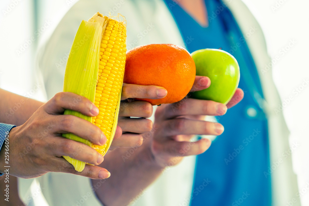 Group of nutritionists presenting diet food of fruit and vegetables for ...
