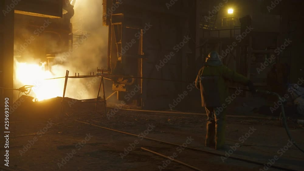 Steelmaking, furnace view for steel melting, working metallurgist near ...