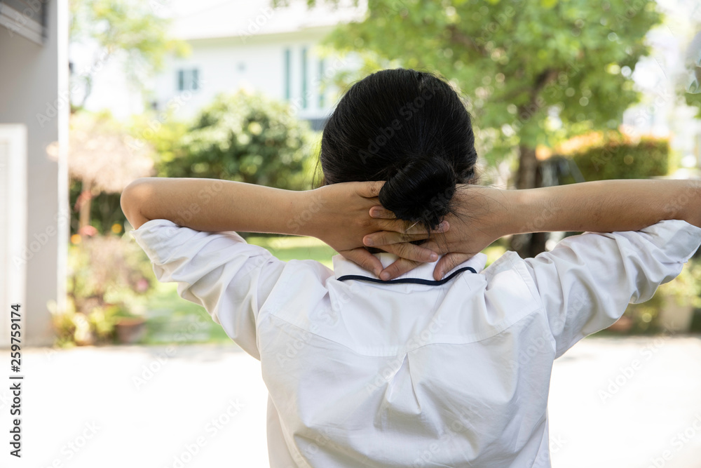 Back view of business woman relaxing stretching outdoor holding hands ...